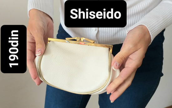Shiseido torbica bele boje sa zlatnim detaljima