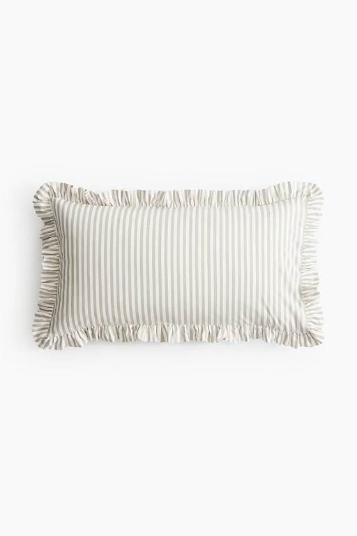 Frill-trimmed cotton cushion cover