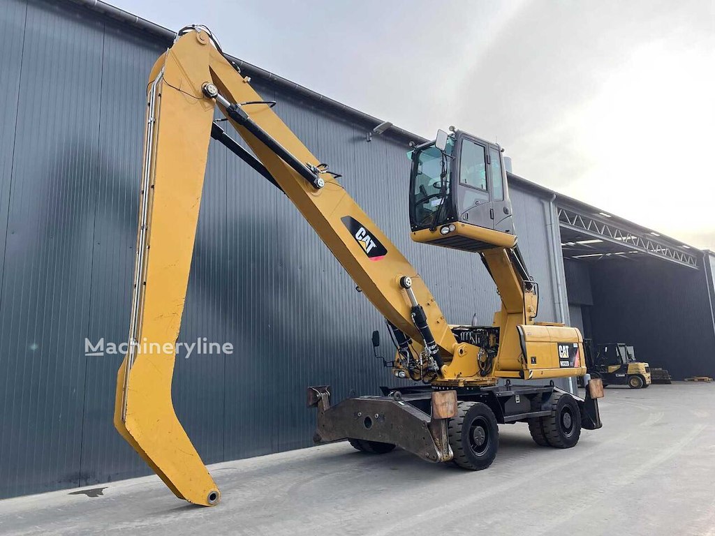 Prodaje se Caterpillar M 322D MH bager za pretovar na aukciji