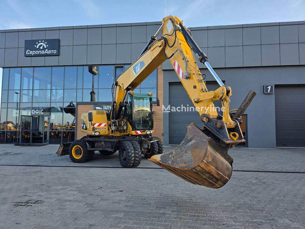 Caterpillar 315D bager točkaš