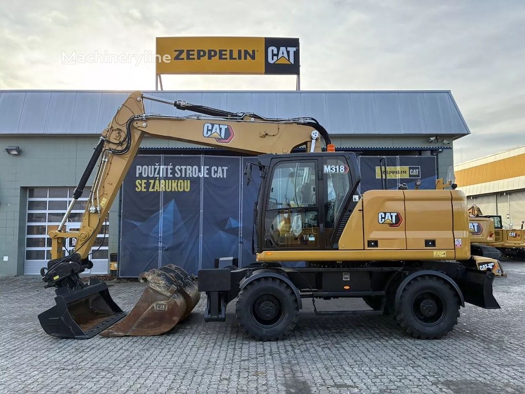 Caterpillar M318 bager točkaš