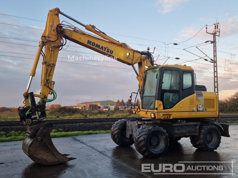 Prodaje se Komatsu PW140-7 bager za pretovar na aukciji