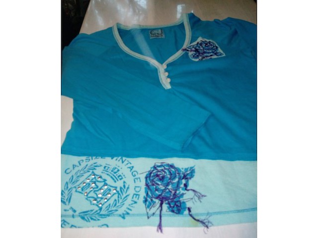 tirkizno plava bluza sa vezenim motivima
