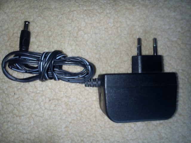 AC-DC Adapter 12V 1.5A DVE model:DSA-18PFM-12 FEU120150