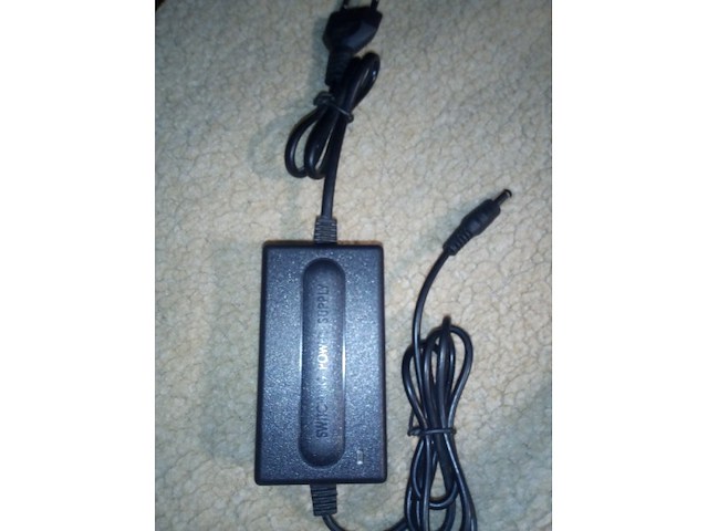 AC-DC Adapter 12V 2A model: JD-1220