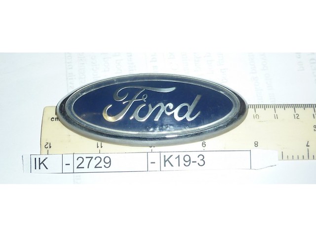 Znak FORD. Malo je nabubrio u donjem delu, ne znam koli