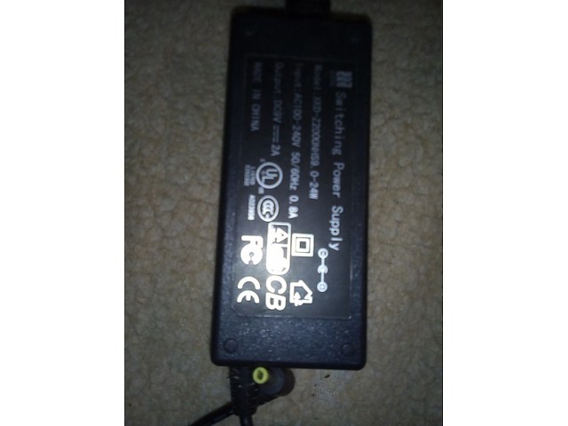 AC-DC Adapter 9V 2A model: XKD-Z2000NHS9.0-24E