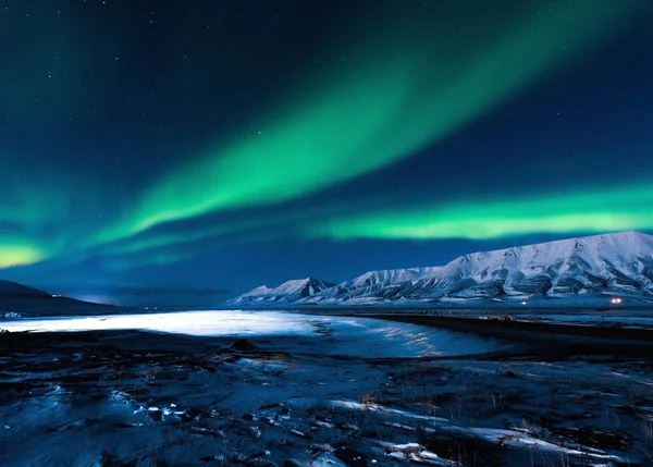 Svalbard The polar Northern lights in the mountains