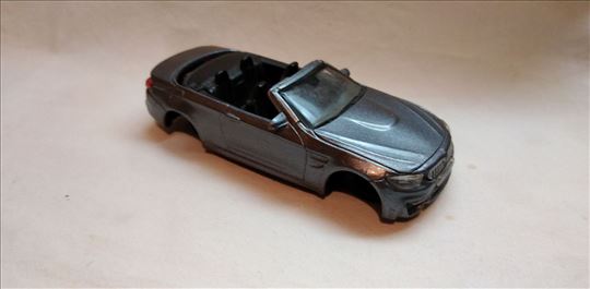 Burago BMW M4, 1:43, osovine i tockovi nedostaju.