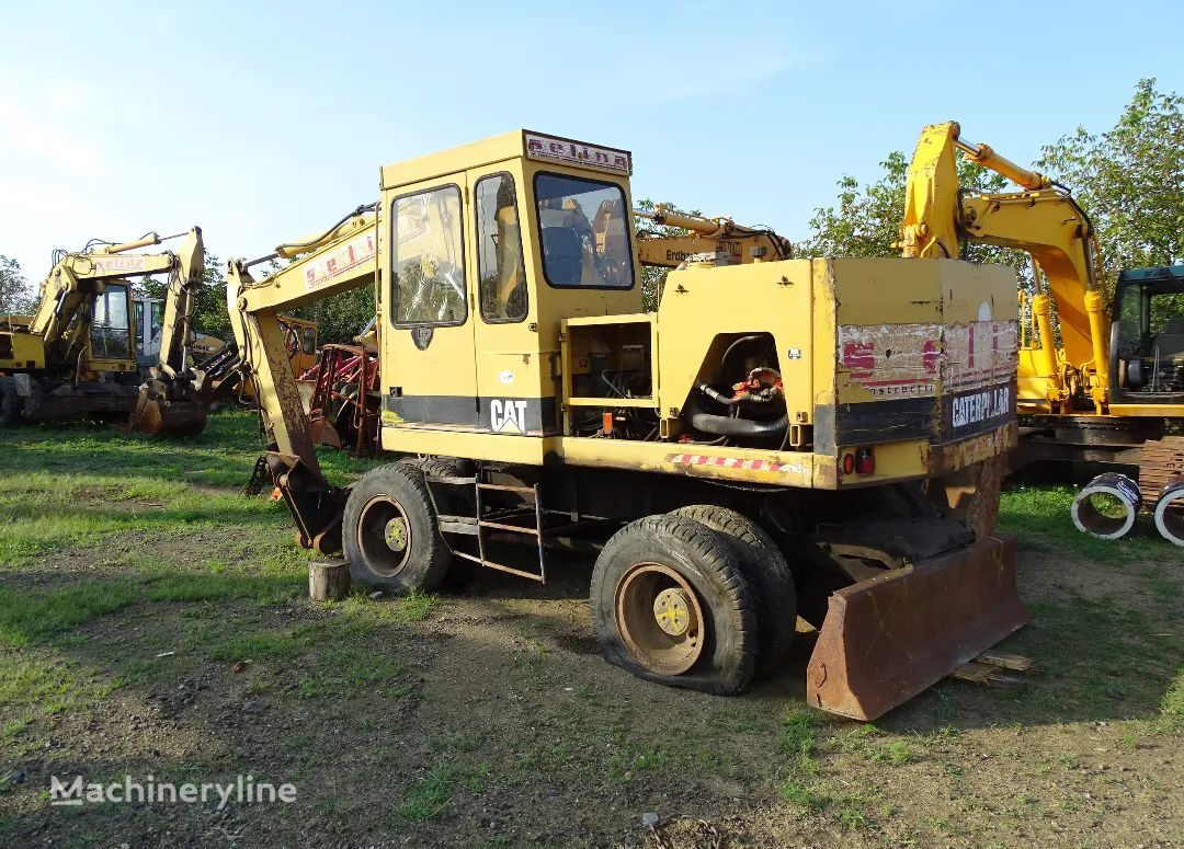 Caterpillar 206 si 212 bager točkaš