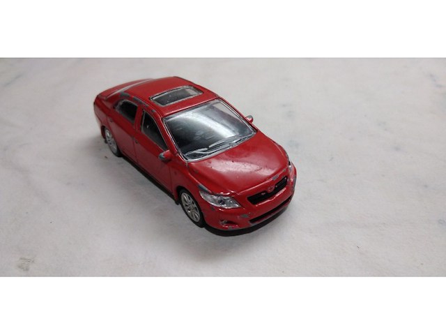 Rastar Toyota Corolla 1:43,fali l. far,ostecen pa zalep