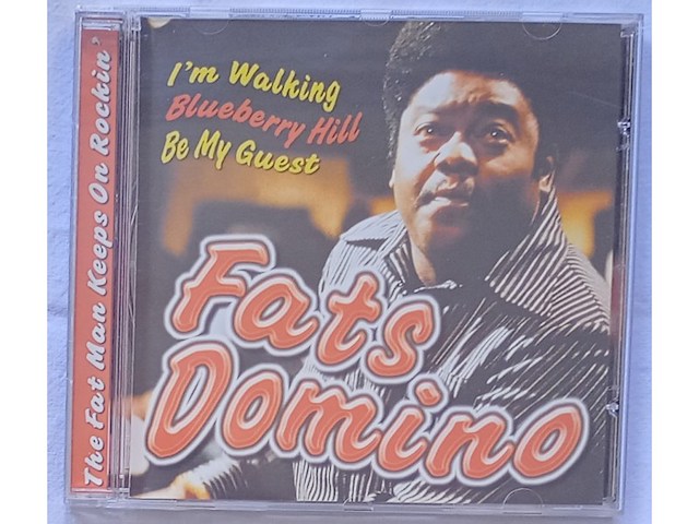 FATS  DOMINO  -  The  fat  man  keeps  on  rockin`