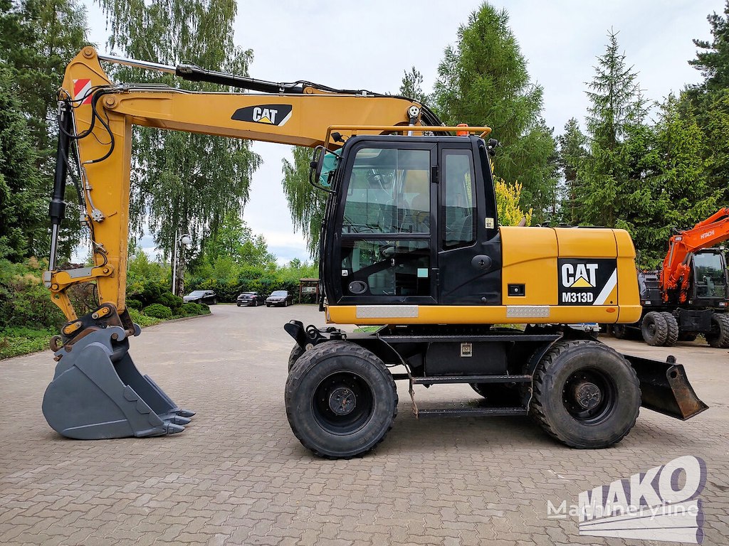 Caterpillar M313D bager točkaš