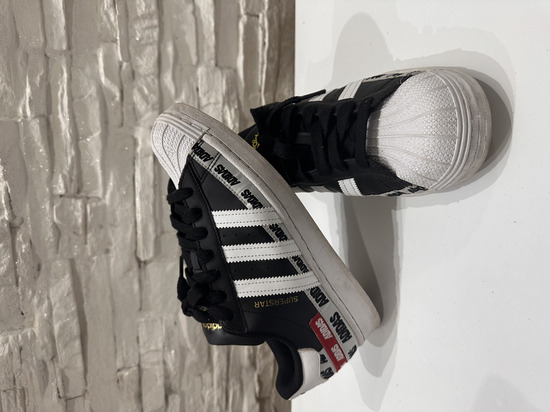 Adidas super star ticker tape