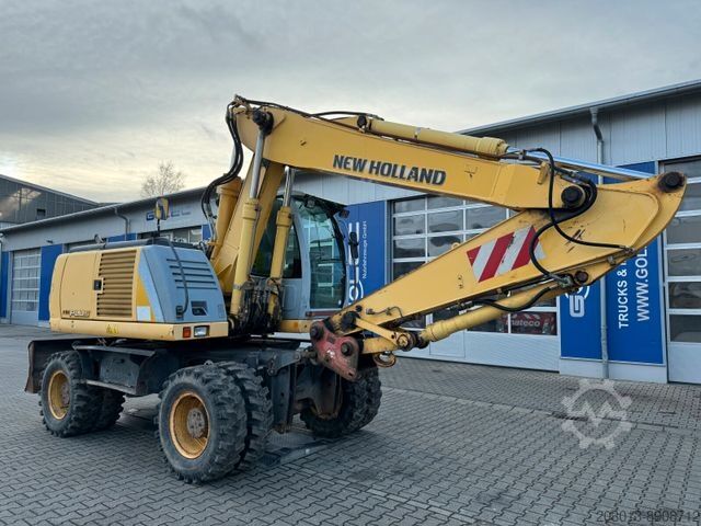 Mobilni bager
NEW HOLLAND MH PLUS Mobilbagger 18 Tonnen *Räumschild