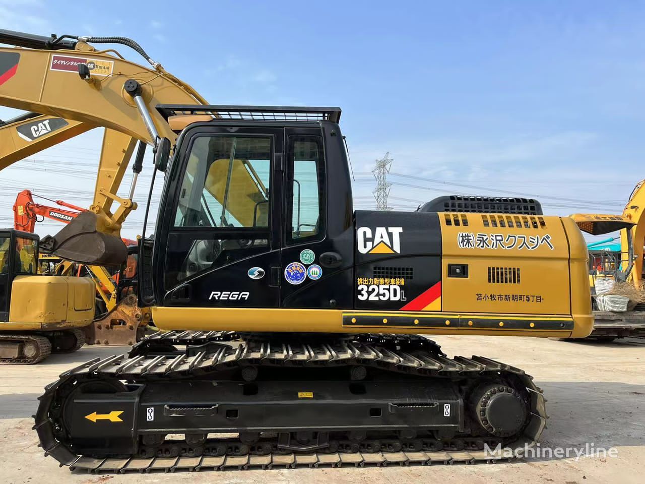 Caterpillar 325DL bager-utovarivač