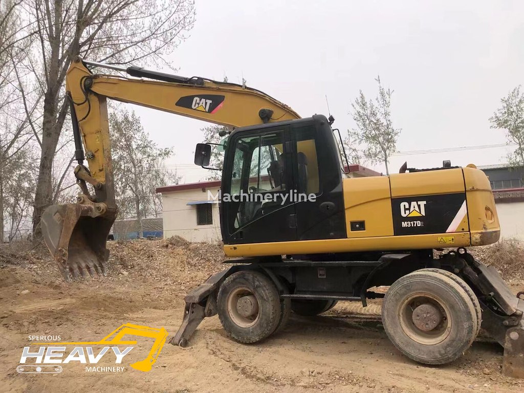 Caterpillar M317D2 bager točkaš