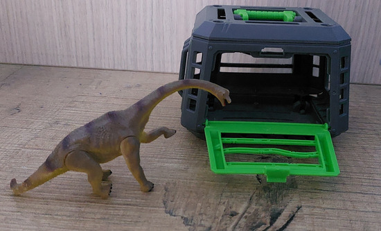 Igračka dinosaurus s kavezom