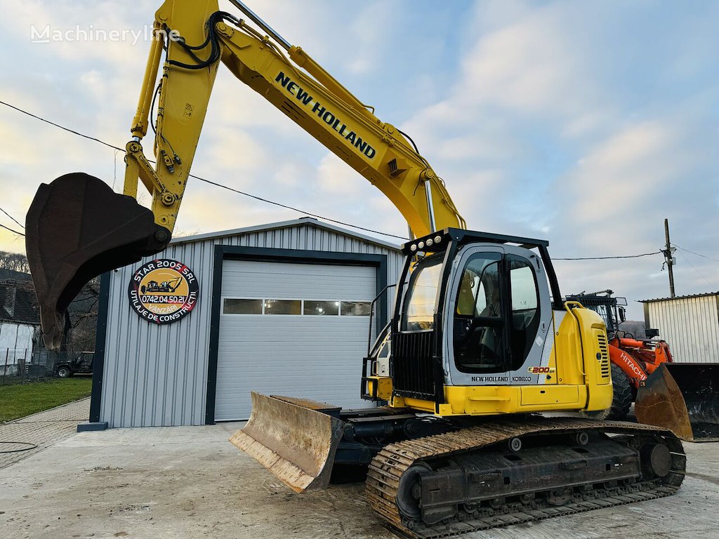 New Holland E 200 SR bager guseničar