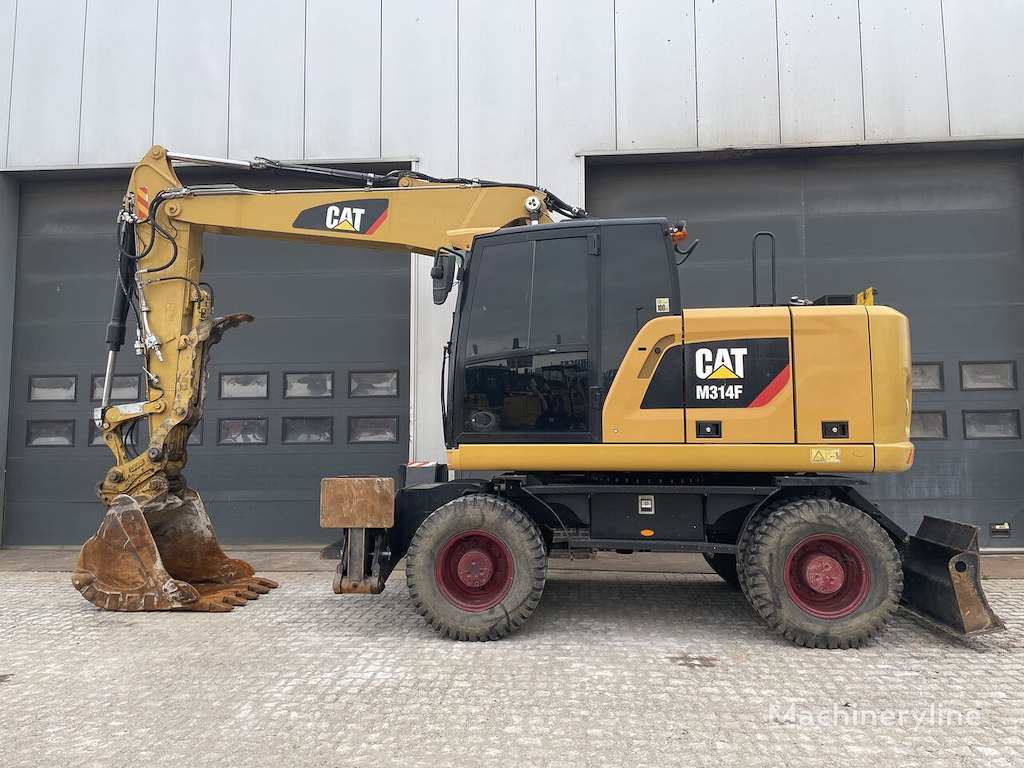 Caterpillar M314F with Outriggers bager točkaš