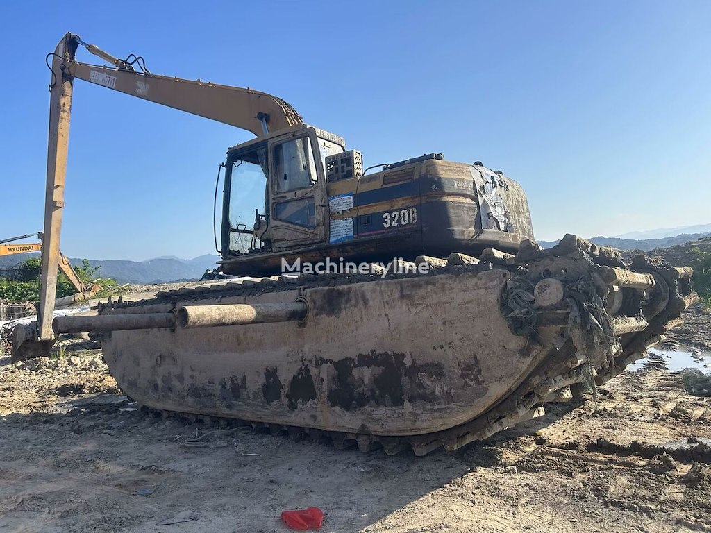 Caterpillar 320B bager amfibija