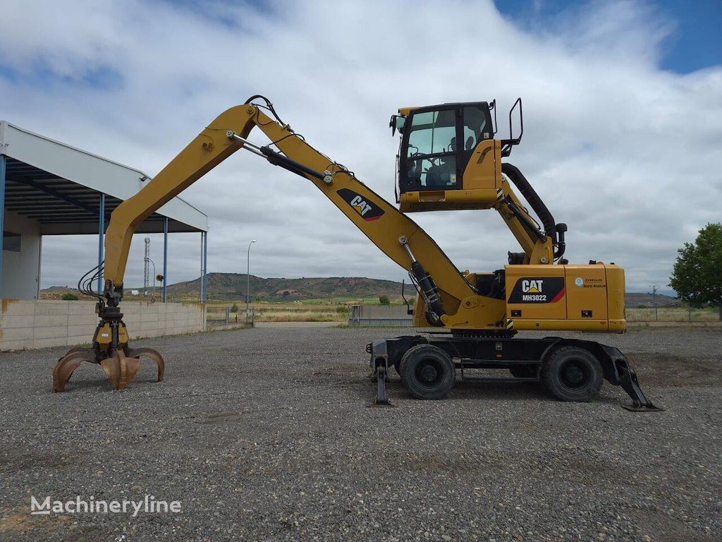 Caterpillar MH3022 bager točkaš