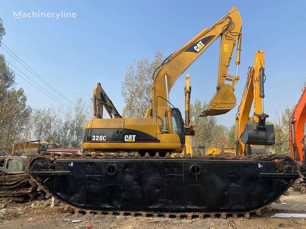 Caterpillar 320C bager amfibija