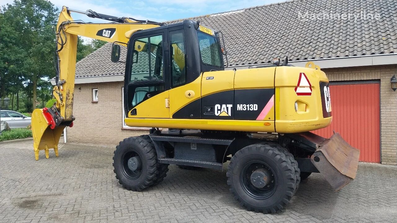 Caterpillar M 313 D / Dutch machine bager točkaš