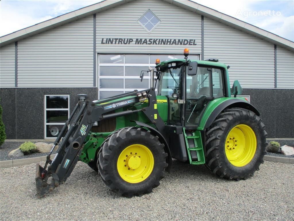 John Deere 6920 AutoPower med fuldhydraulisk Trima frontlæsser og frontlift traktor točkaš