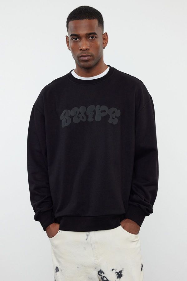 TRENDYOL BLACK OVERSIZE/WIDE CUT EMBOSSED PRINTED SWEATSHIRT