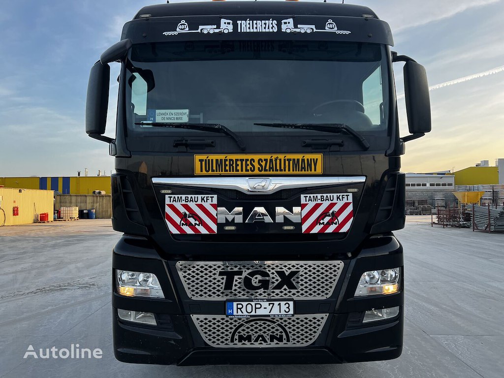 MAN TGX 26.440 tegljač + poluprikolica autotransportera