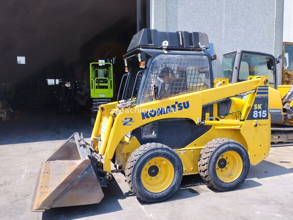 Komatsu SK815 mini utovarivač