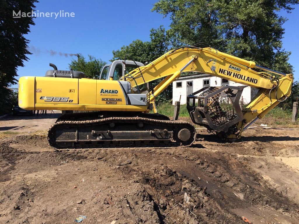 New Holland E385 B bager guseničar