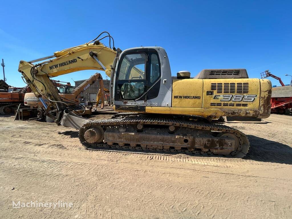 New Holland E 385 C LC bager guseničar