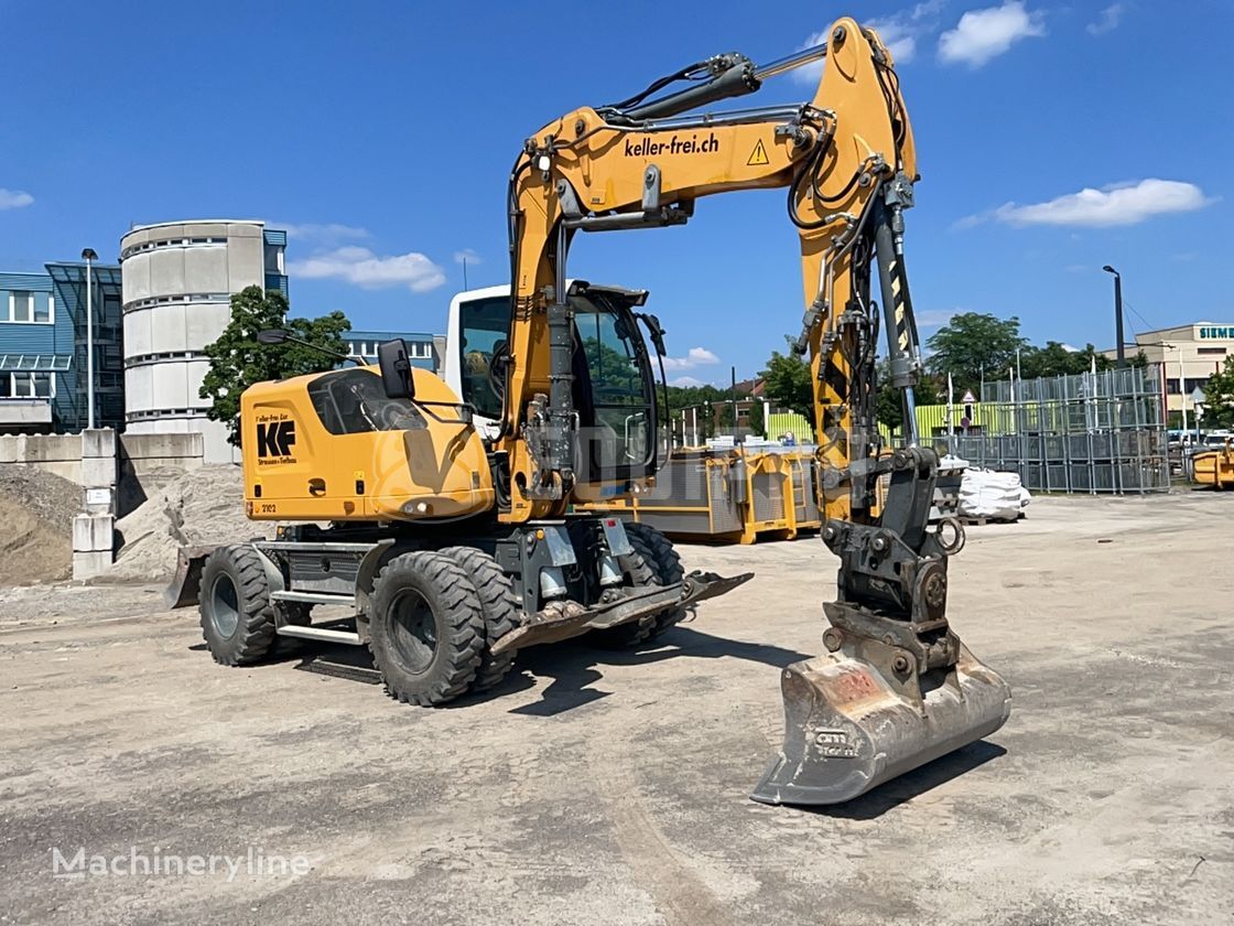 Liebherr A 912 Compact with powertilt quickcoupler and bucket bager točkaš