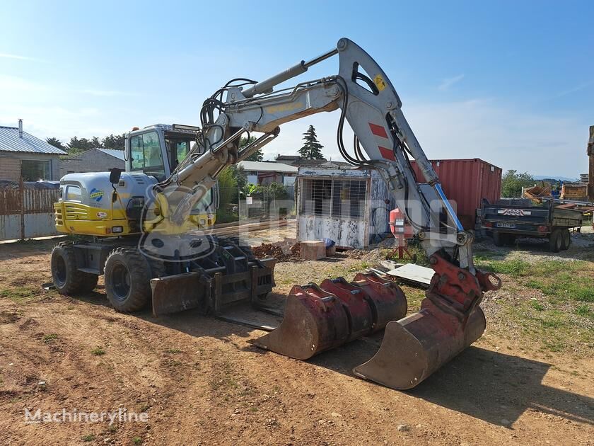 Takeuchi TB 295 W with 4 buckets and palletfork bager točkaš