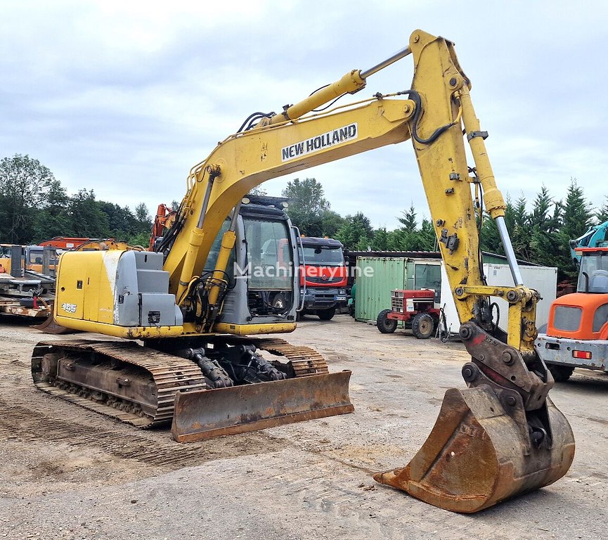 New Holland E145 bager guseničar