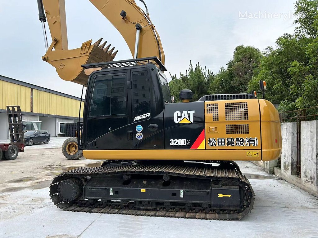 Caterpillar 320D koračajući bager