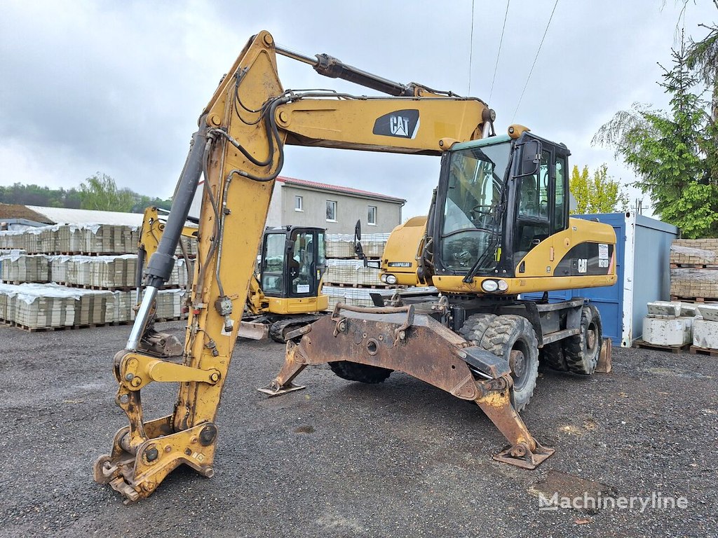 Prodaje se Caterpillar M 318 D 4X4 bager točkaš na aukciji