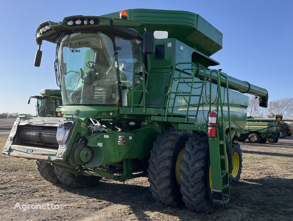 John Deere S670 (mozhlyvyi lizynh) kombajn za žito