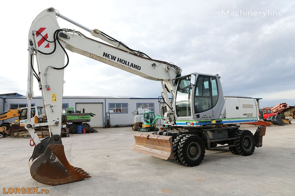 New Holland MH 6.6 + Sandvic Hammer bager točkaš