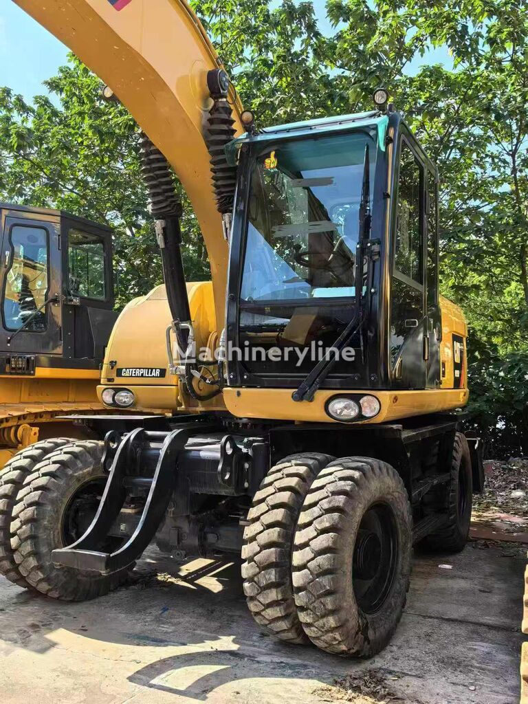 Caterpillar M315D2 bager guseničar