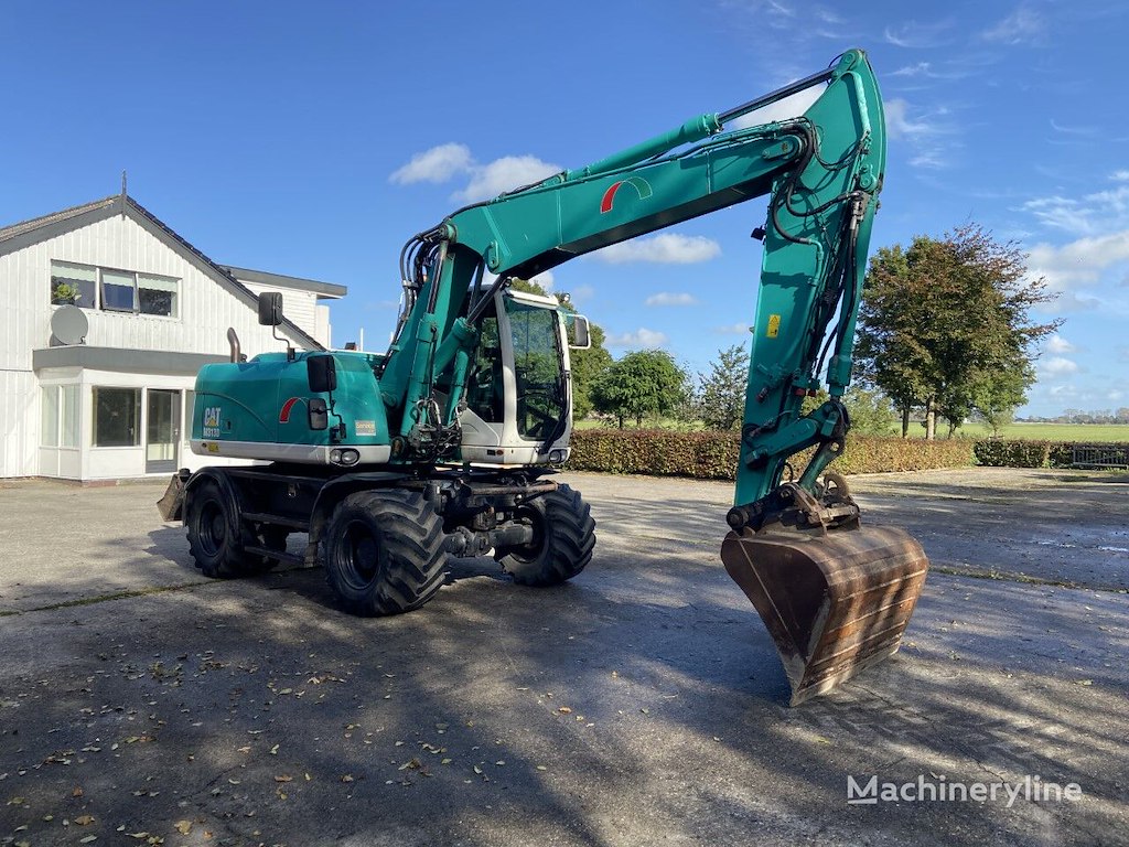 Caterpillar M313D bager točkaš