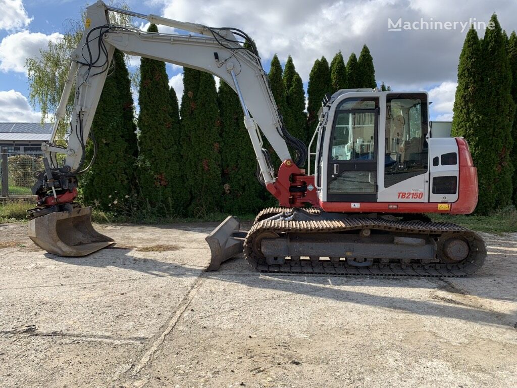 Takeuchi TB 2150 + ROTOTILT S60 + GRIP + central greasing bager guseničar