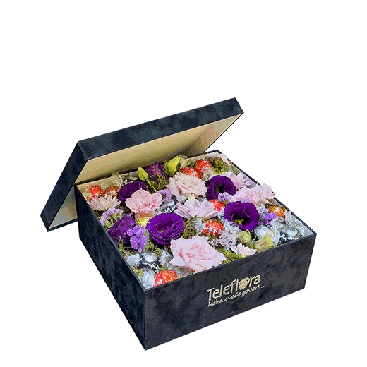 Flowers and chocolates in a box