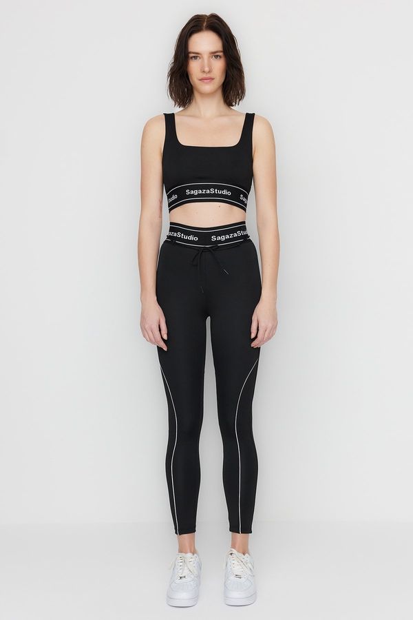 TRENDYOL X SAGAZA STUDIO BLACK STRETCHY SPORTS TIGHTS WITH PIPING DETAILED AND PUSH-UP STITCHING.