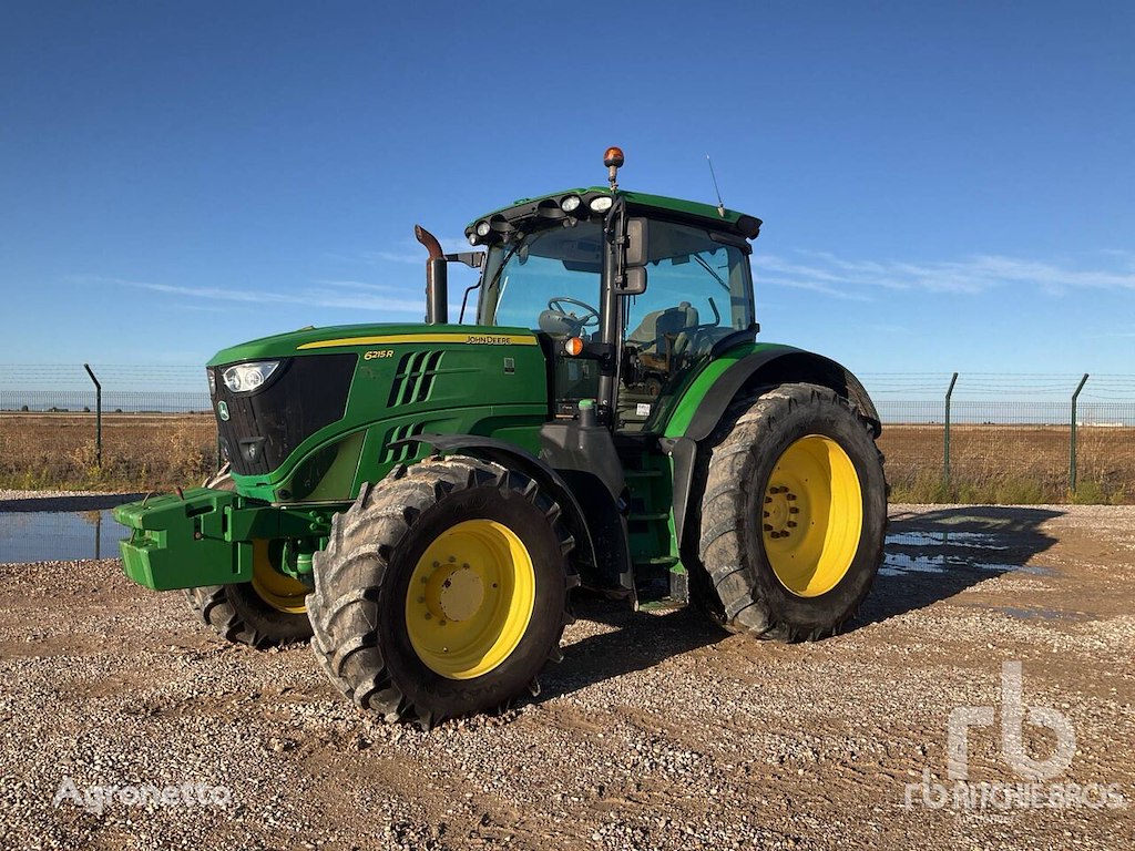 Prodaje se John Deere 6215R traktor točkaš na aukciji