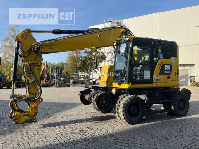 Caterpillar M323F bager na šinama