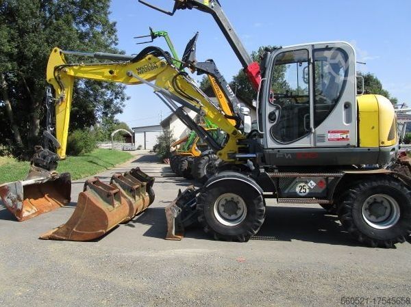 Mobilni bager
Neuson EW 100 mit POWERTILT + Schnellw.+ 6 Löffel