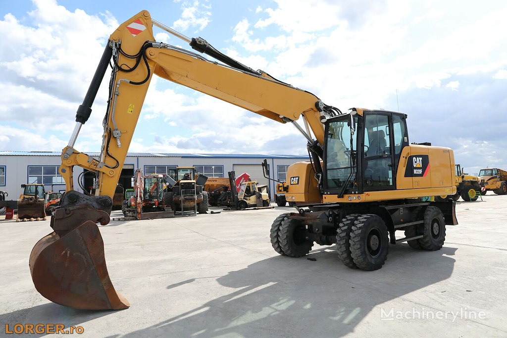 Caterpillar M 320 F bager točkaš